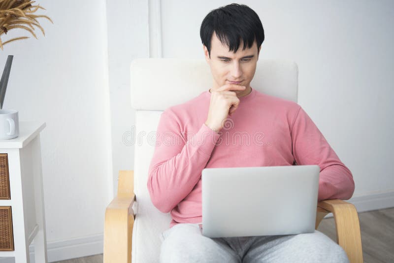 Man Working on Laptop Computer with Thinking Thoughtful Stock Photo ...