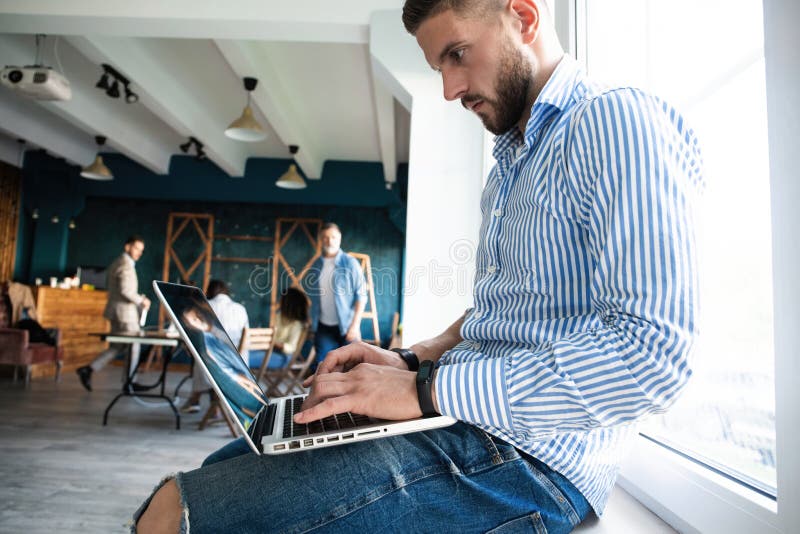 Man Working at Laptop in Contemporary Office Stock Photo - Image of ...