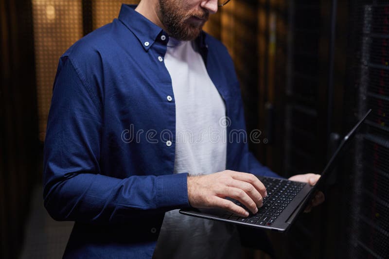 Man Working with Laptop in Data Center Environment Stock Photo - Image ...