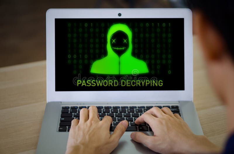 A Man is Working on a Laptop, Decrypting a Password Displayed on the ... A Man is Working on a Laptop, Decrypting a Password Displayed on the ...