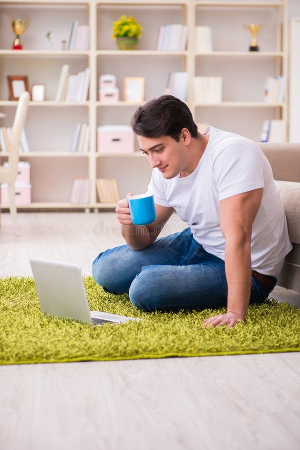 The Man Working on Laptop at Home on Carpet Floor Stock Photo - Image ...
