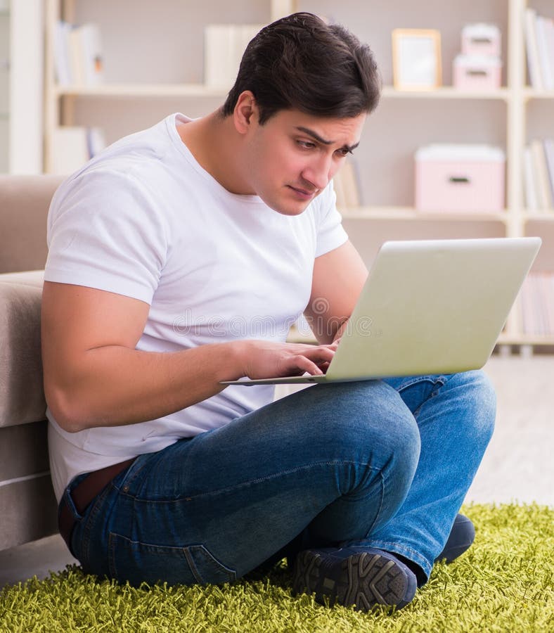 Man Working on Laptop at Home on Carpet Floor Stock Image - Image of ...