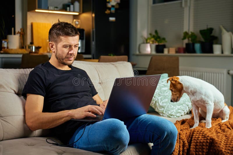Man Working on Laptop at Home with Dog Stock Image - Image of online ...