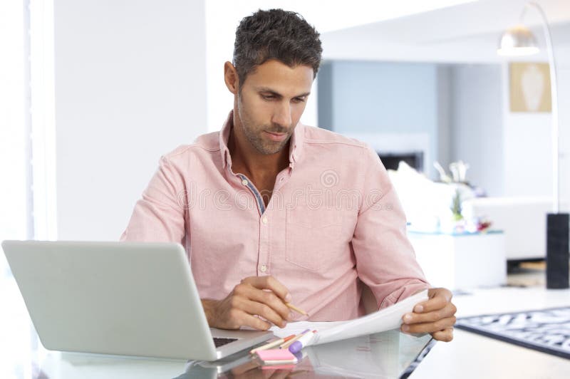 Man Working at Laptop in Home Office Stock Image - Image of male, bills ...