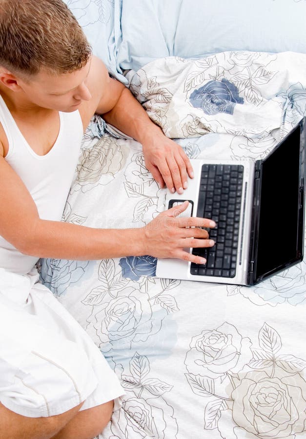 Man Working on Laptop Laying in Bed Stock Image - Image of posing ...