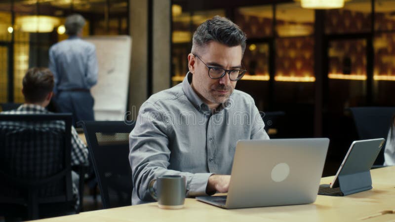 Man Working on Laptop in Modern Office Stock Photo - Image of ...