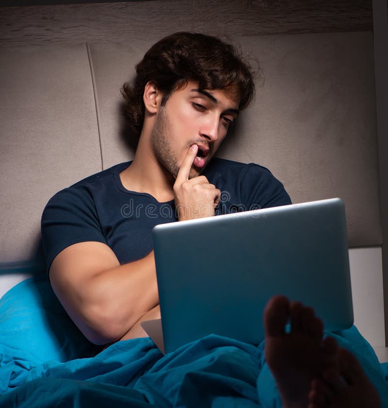The Man Working on Laptop at Night in Bed Stock Photo - Image of ...