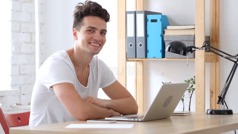 Man Working on Laptop Smiling Toward Camera Stock Image - Image of ...