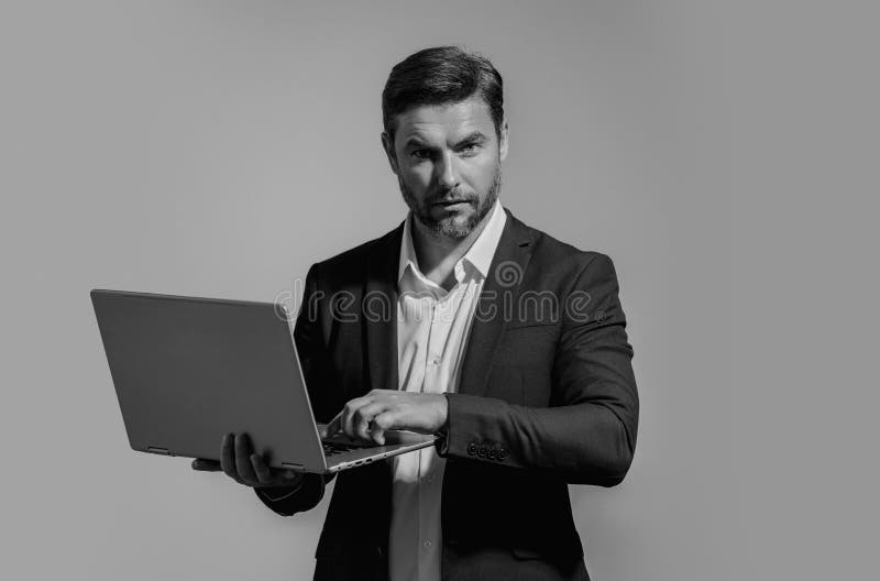 Man Working on Laptop in Studio. Man in Suit Checking Email on Laptop ...