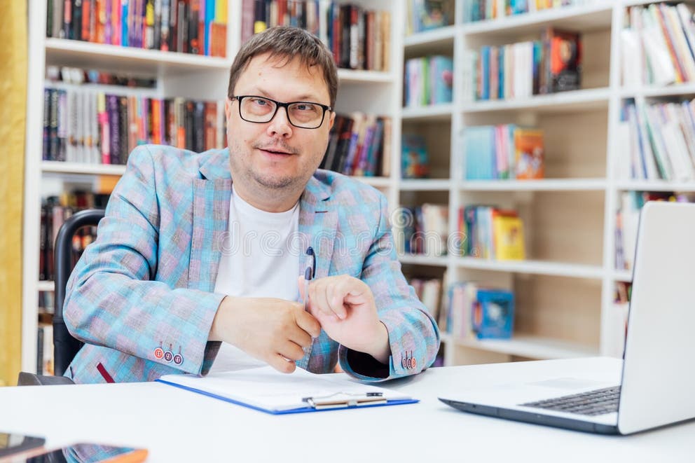 Man Working Learning at Desk with Laptop in Library with Books Stock ...