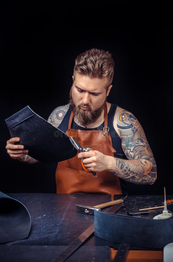 Leather Tanner Working with Leather Using Crafting Tools in His Shop ...
