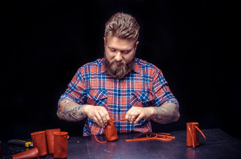 Craftsman Working with Leather Processing a Leather Workpiece at His ...