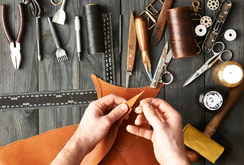 Man working with leather stock photo. Image of manual - 66525862