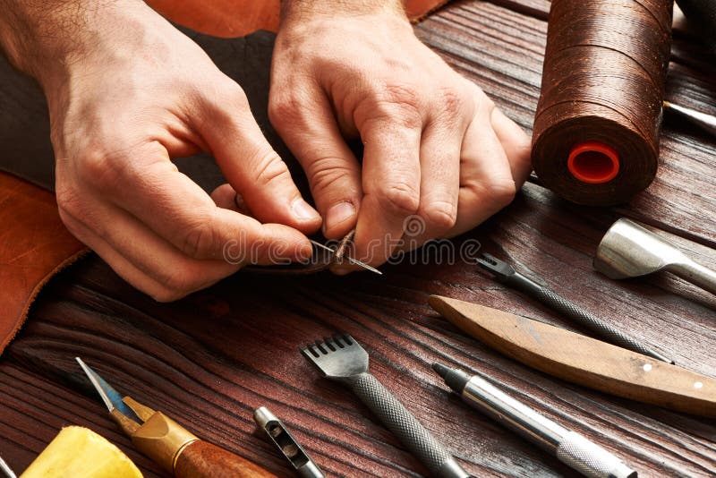 Man working with leather stock photo. Image of knife - 67970062