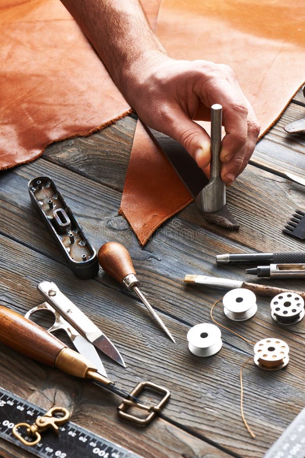 Man working with leather stock photo. Image of hobby - 68755630