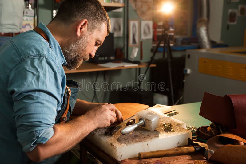 Man Working with Leather Using Crafting Tools. Stock Image - Image of ...