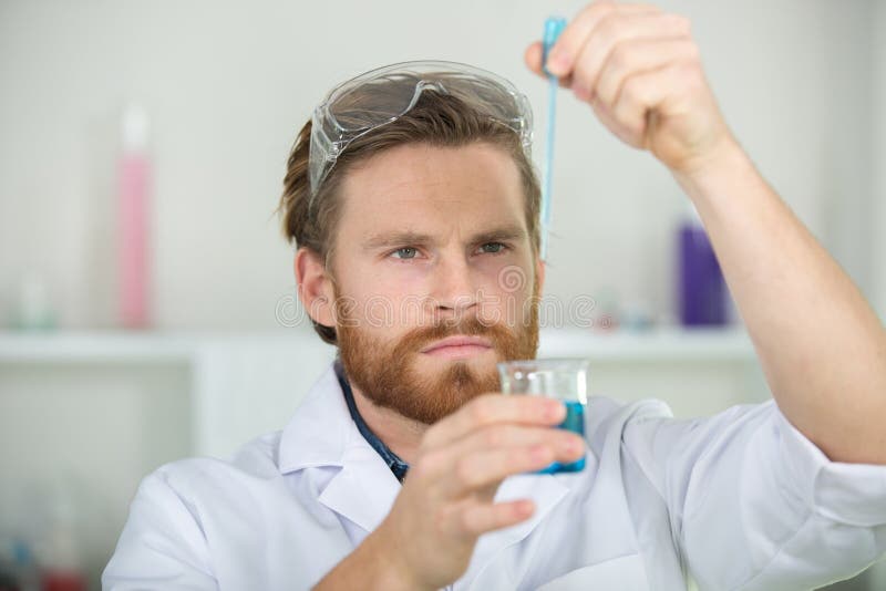 Man Working with Liquids in Lab Stock Photo - Image of beaker ...