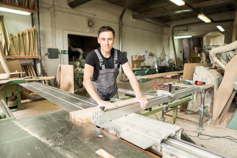 Man Working on a Machine in a Factory Stock Photo - Image of sliding ...