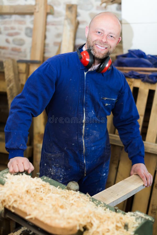Man Working on a Machine at Wood Workshop Stock Image - Image of ...
