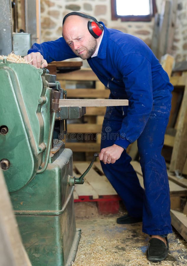 Man Working On A Machine At Wood Workshop Stock Photo - Image of cutter ...