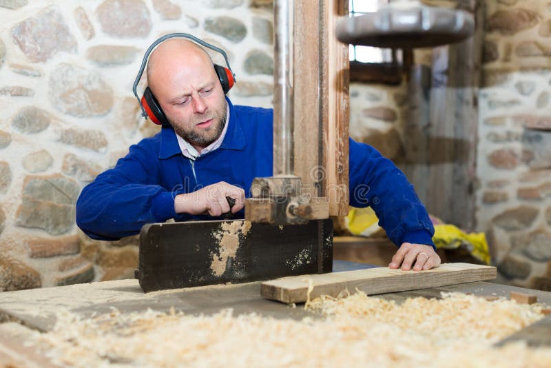 Man Working on a Machine at Wood Workshop Stock Image - Image of ...