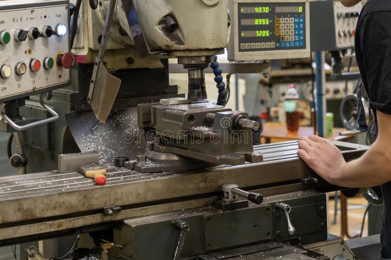 A Man Working on a Milling Machine in a Workshop Stock Photo - Image of ...