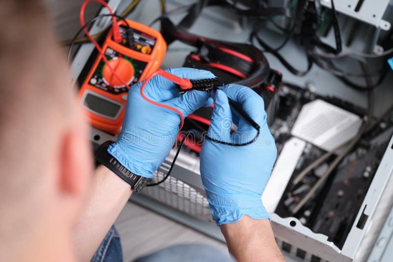 Man Working with Multimeter for Computer Repair Stock Photo - Image of ...