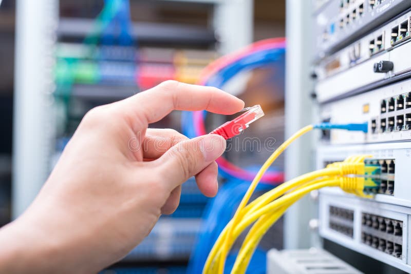Man Working in Network Server Room with Fiber Optic Hub Stock Image ...