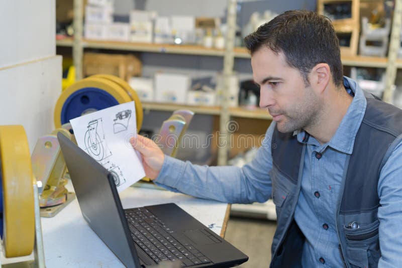 Man Working with New Laptop and Checking Instructions Stock Image ...