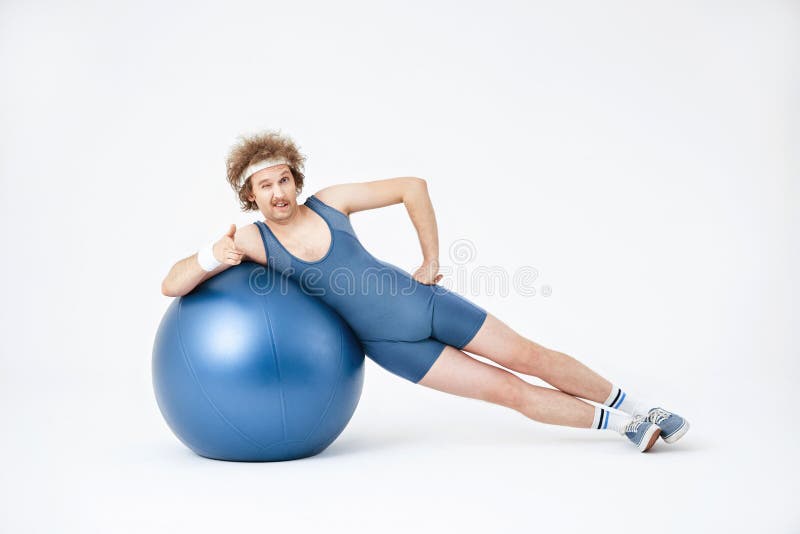 Man Working on Obliques, Winking and Pointing at Camera Stock Image ...