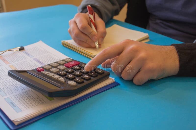 Man Working on Office Desk with Calculator. Man Hand with Calculator ...