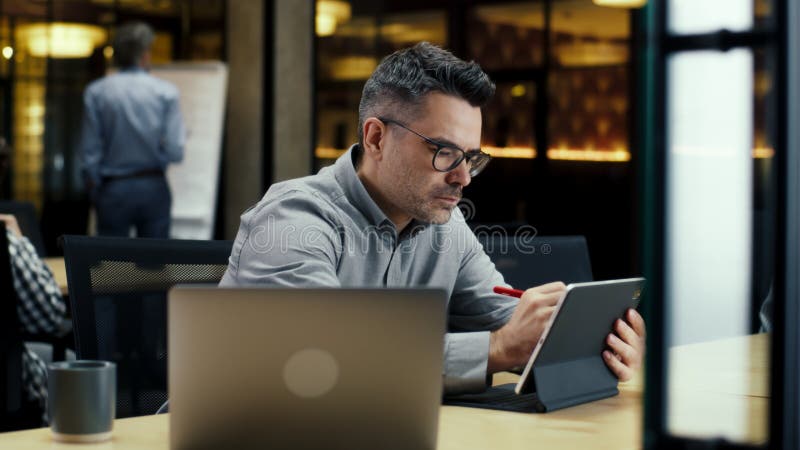 Man Working in Office on Digital Tablet Stock Photo - Image of agency ...