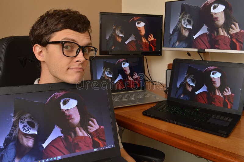 Man Working in Office with Multiple Computer Screens Stock Photo ...