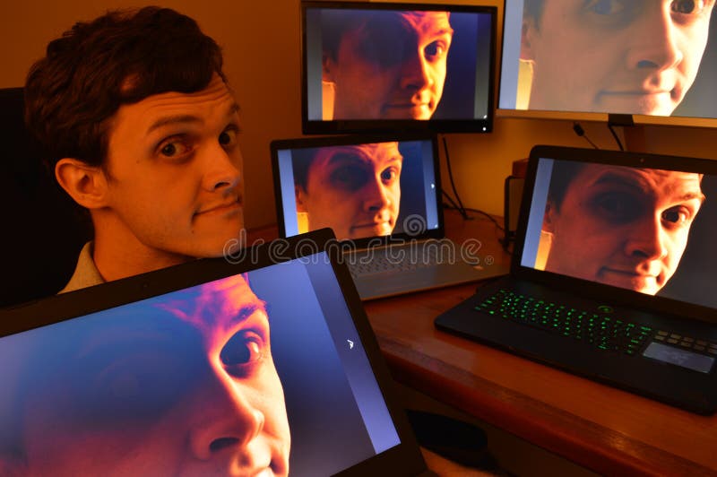 Man Working in Office with Multiple Computer Screens Stock Image ...