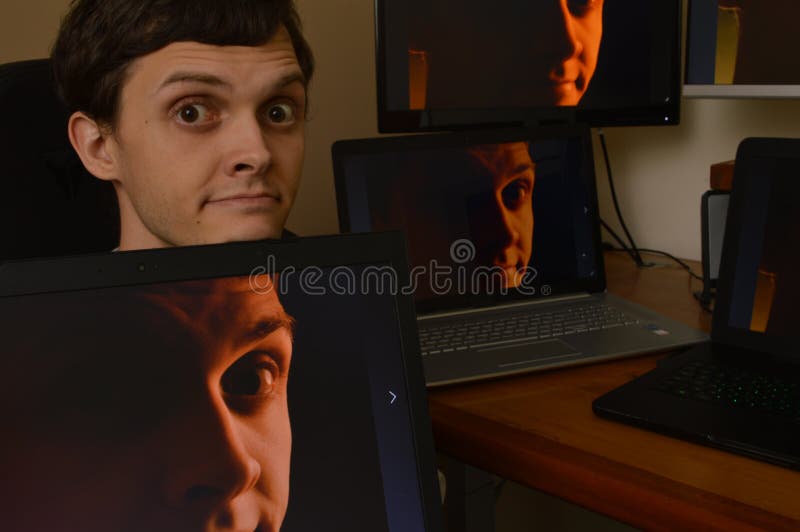 Man Working in Office with Multiple Computer Screens Stock Photo ...