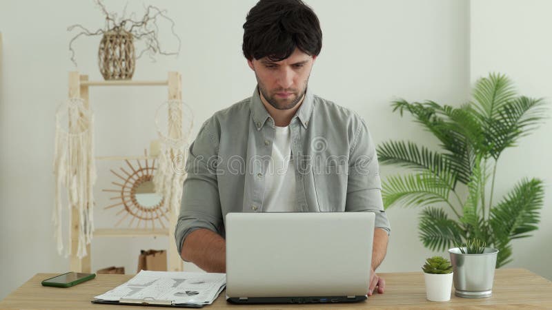 Man Working in Office Using Laptop in Office. Young Professional ...