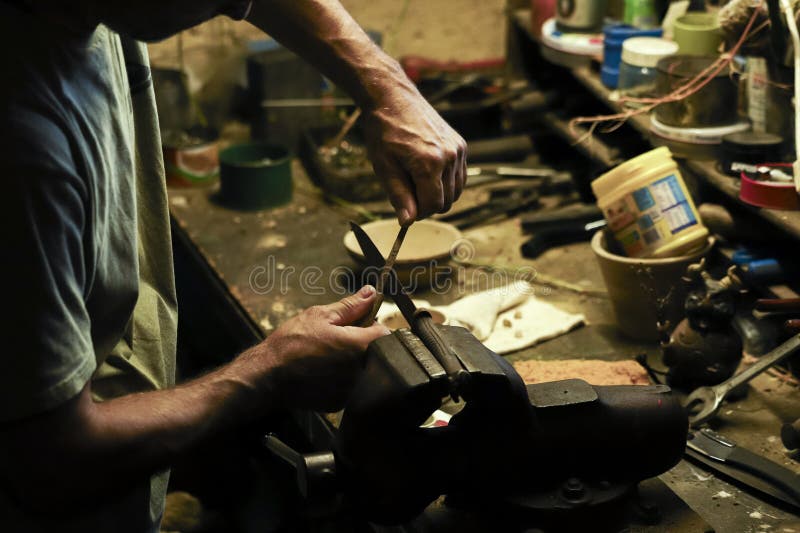 Man Working in an Old Retro Workshop with Dim Light. Atmospheric Stock ...
