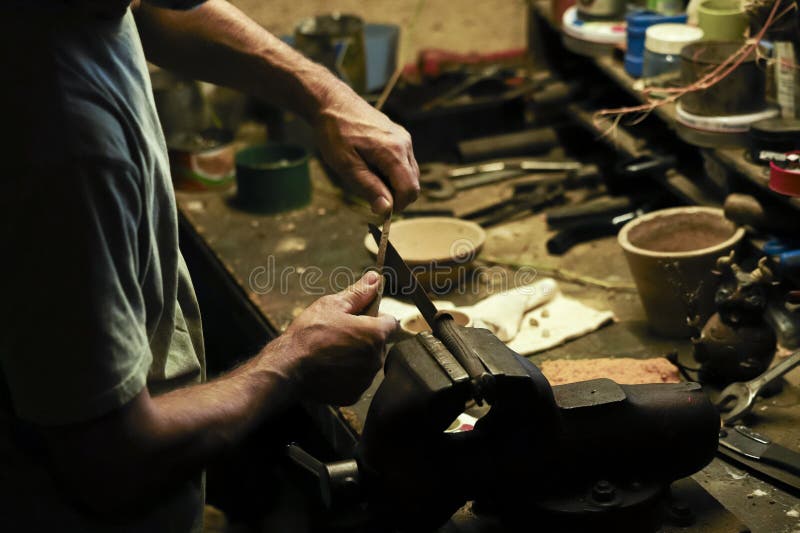 Man Working in an Old Retro Workshop with Dim Light. Atmospheric Stock ...