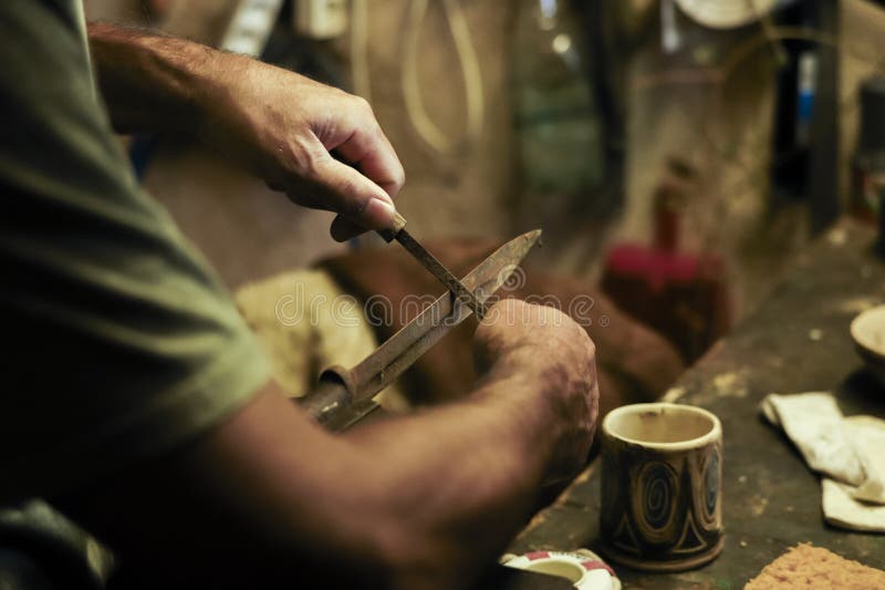 Man Working in an Old Retro Workshop with Dim Light. Atmospheric Stock ...