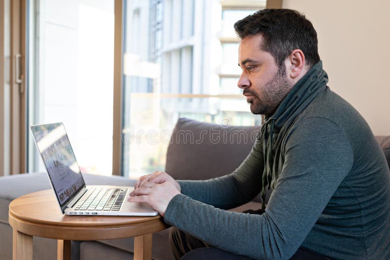 Man Working Online at Home or Study Using Laptop on Sofa. Stay Home ...