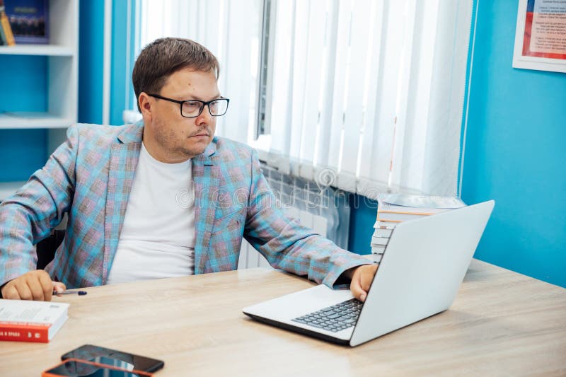Man Working Online on Laptop at Desk in Office Stock Image - Image of ...