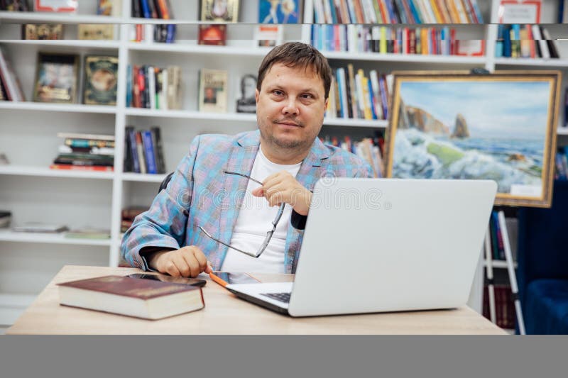 Man Working Online Learning on Laptop at Desk in Office Stock Photo ...