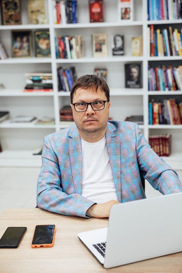 Man Working Online Learning on Laptop at Desk in Office Stock Photo ...