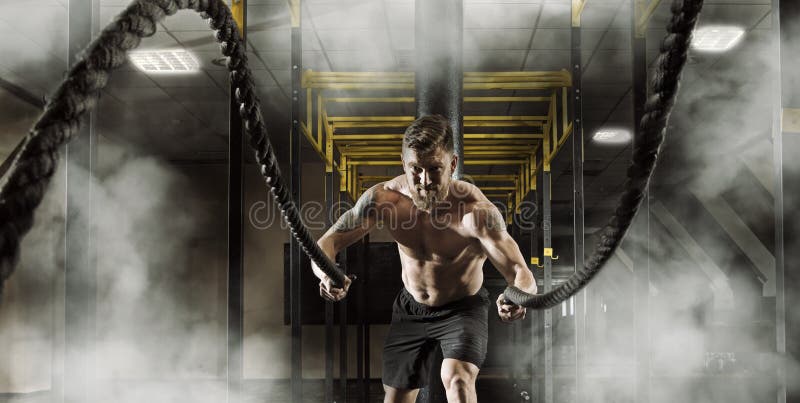 Man Working Out with Battle Ropes Stock Photo - Image of holding ...