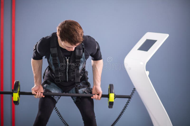 Man Working Out EMS Training with Barbell Closeup, Power Pose Stock ...