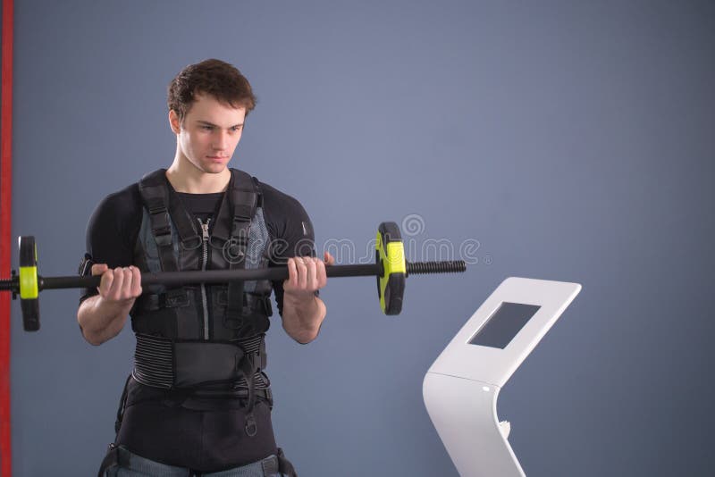 Man Working Out EMS Training with Barbell Closeup, Power Pose Stock ...