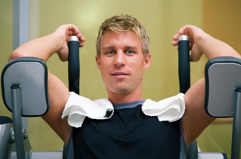Man working out in gym stock photo. Image of leisure, muscular - 6076420