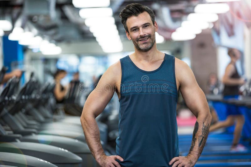 Man working out in gym stock photo. Image of adult, club - 111952714