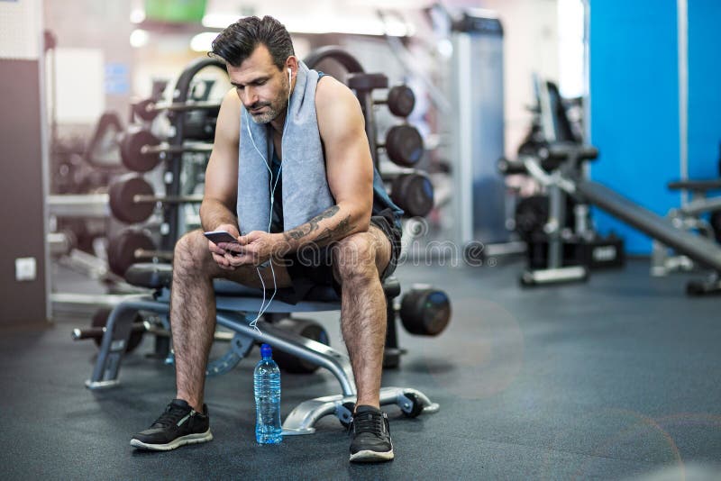 Man working out in gym stock image. Image of club, effort - 111953043