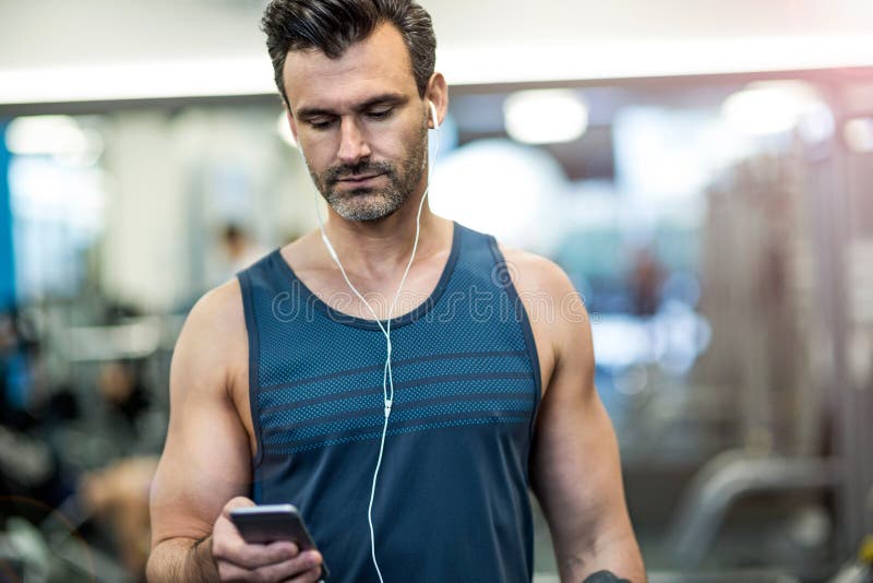 Man working out in gym stock image. Image of fitness - 111938271